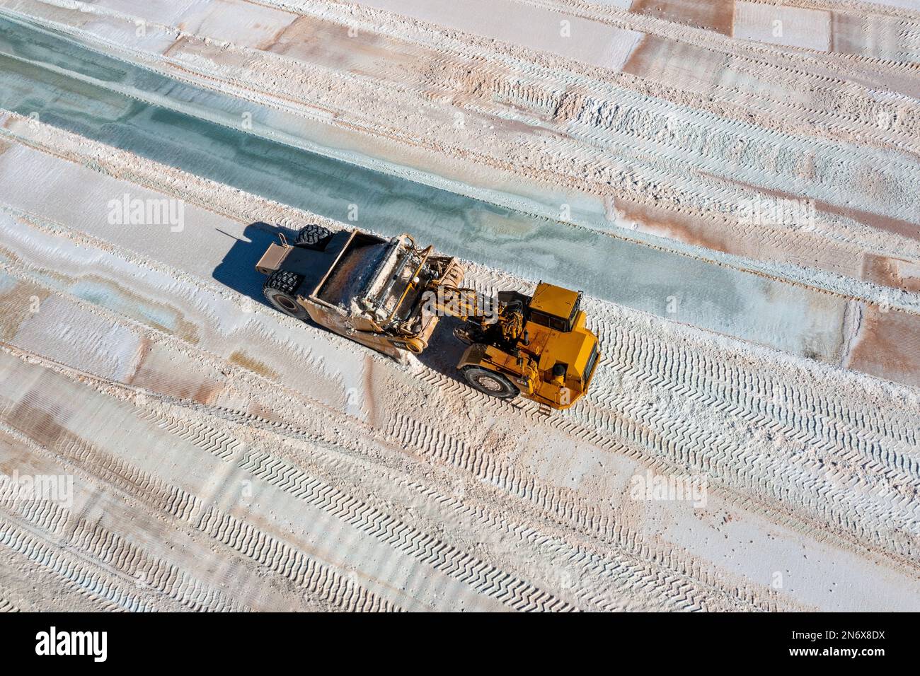A heavy-duty scraper harvesting potash from an evaporation pond at a ...