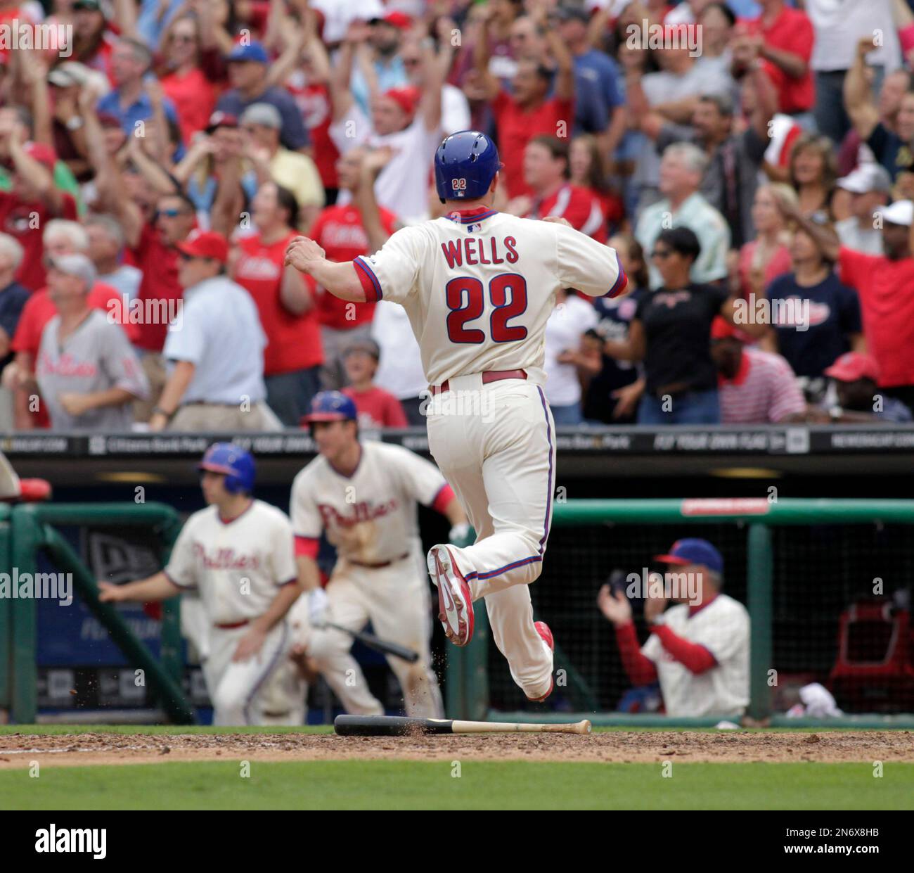 Philadelphia Phillies' Casper Wells scores against the Los Angeles ...