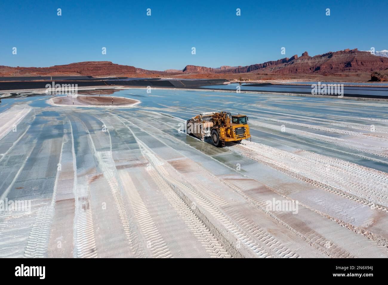 A heavy-duty scraper harvesting potash from an evaporation pond at a ...