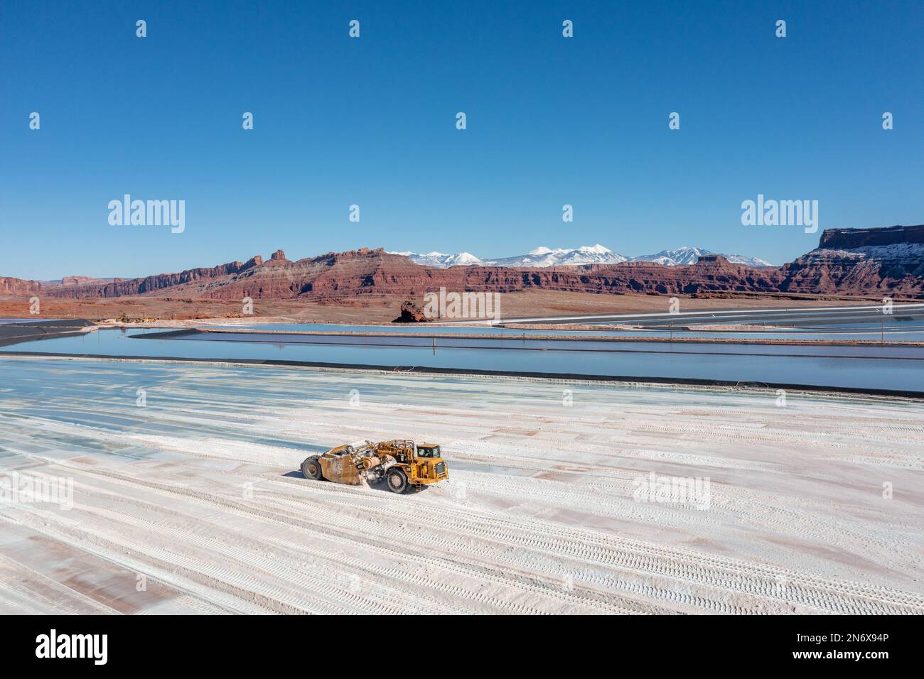 A heavy-duty scraper harvesting potash from an evaporation pond at a ...