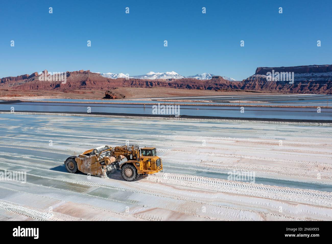 A heavy-duty scraper harvesting potash from an evaporation pond at a ...