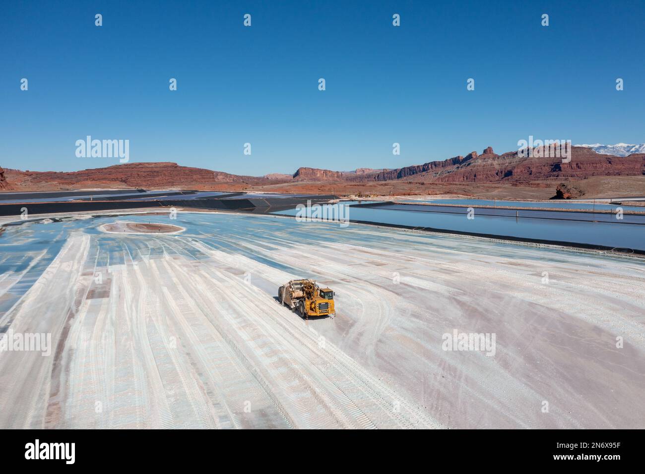 A heavy-duty scraper harvesting potash from an evaporation pond at a ...