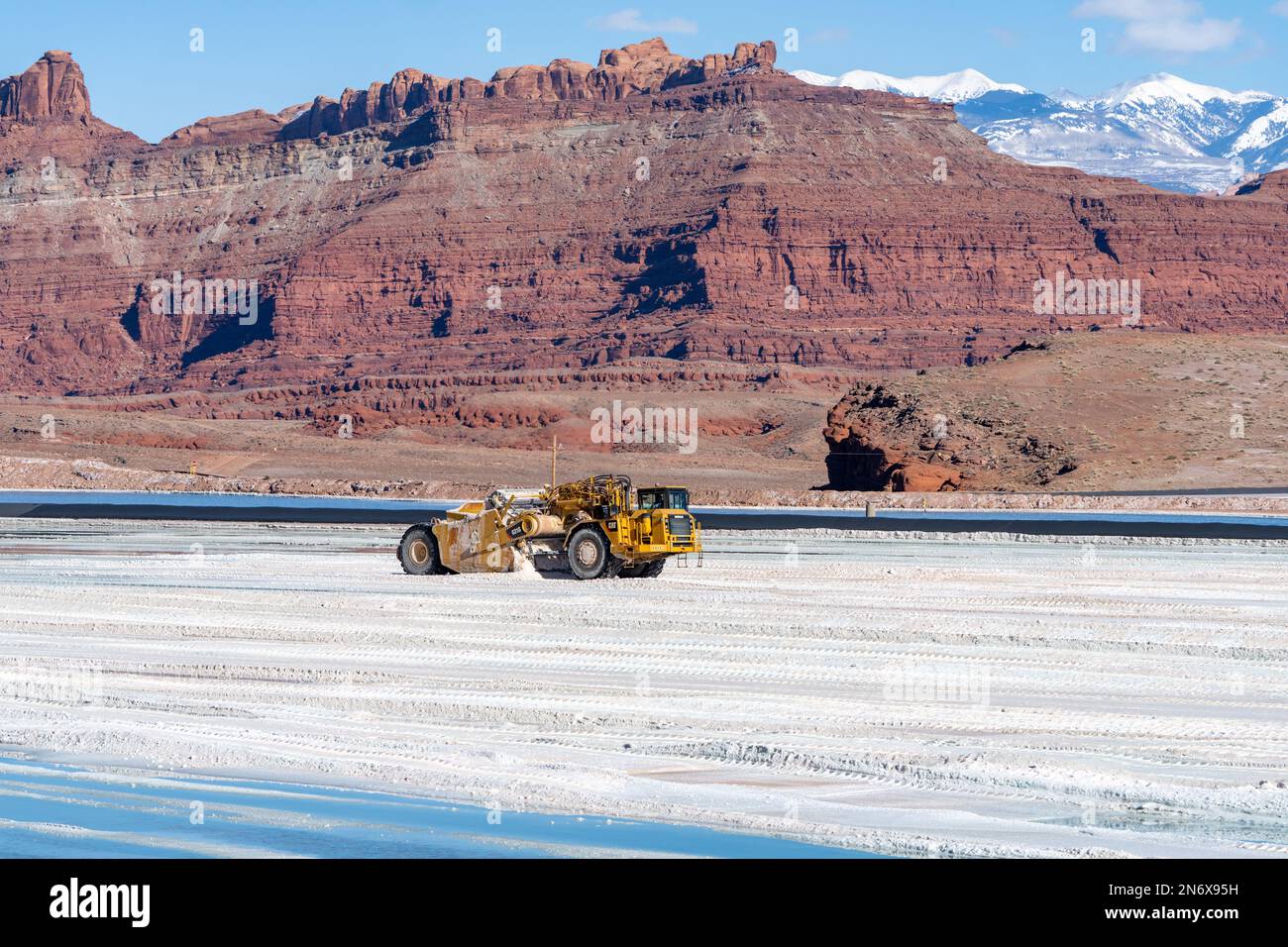 A heavy-duty scraper harvesting potash from an evaporation pond at a ...
