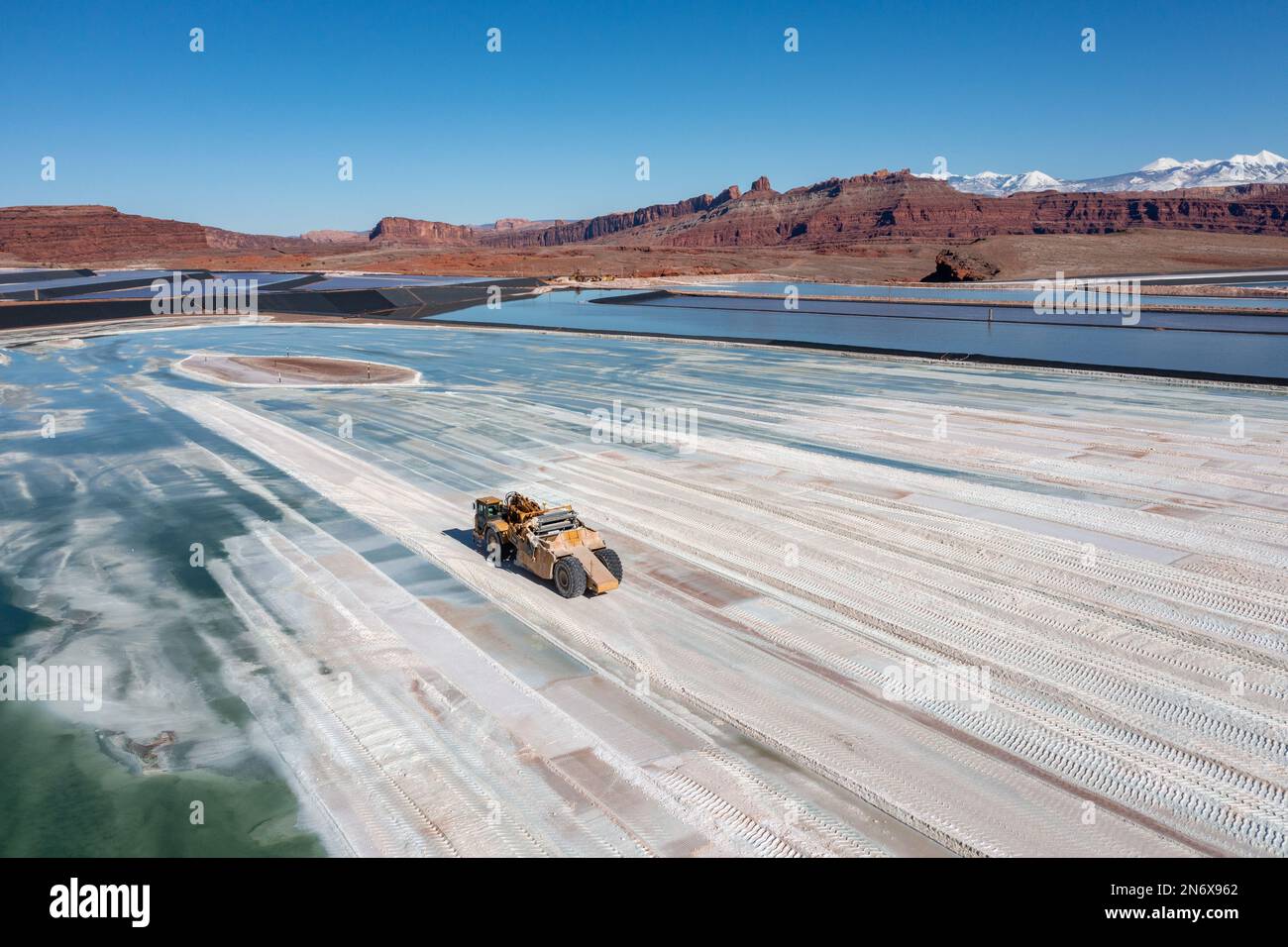 A heavy-duty scraper harvesting potash from an evaporation pond at a ...
