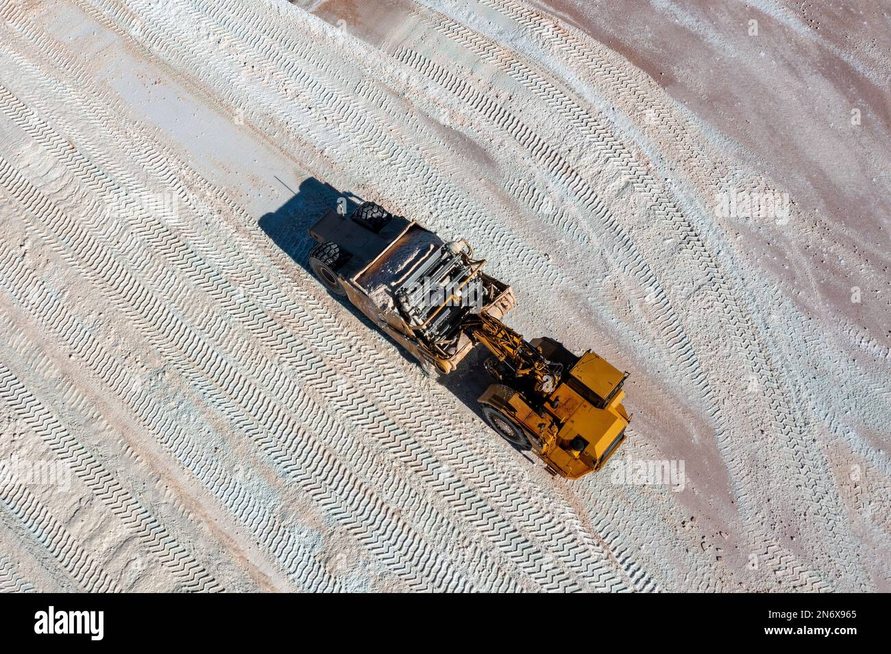 A heavy-duty scraper harvesting potash from an evaporation pond at a ...