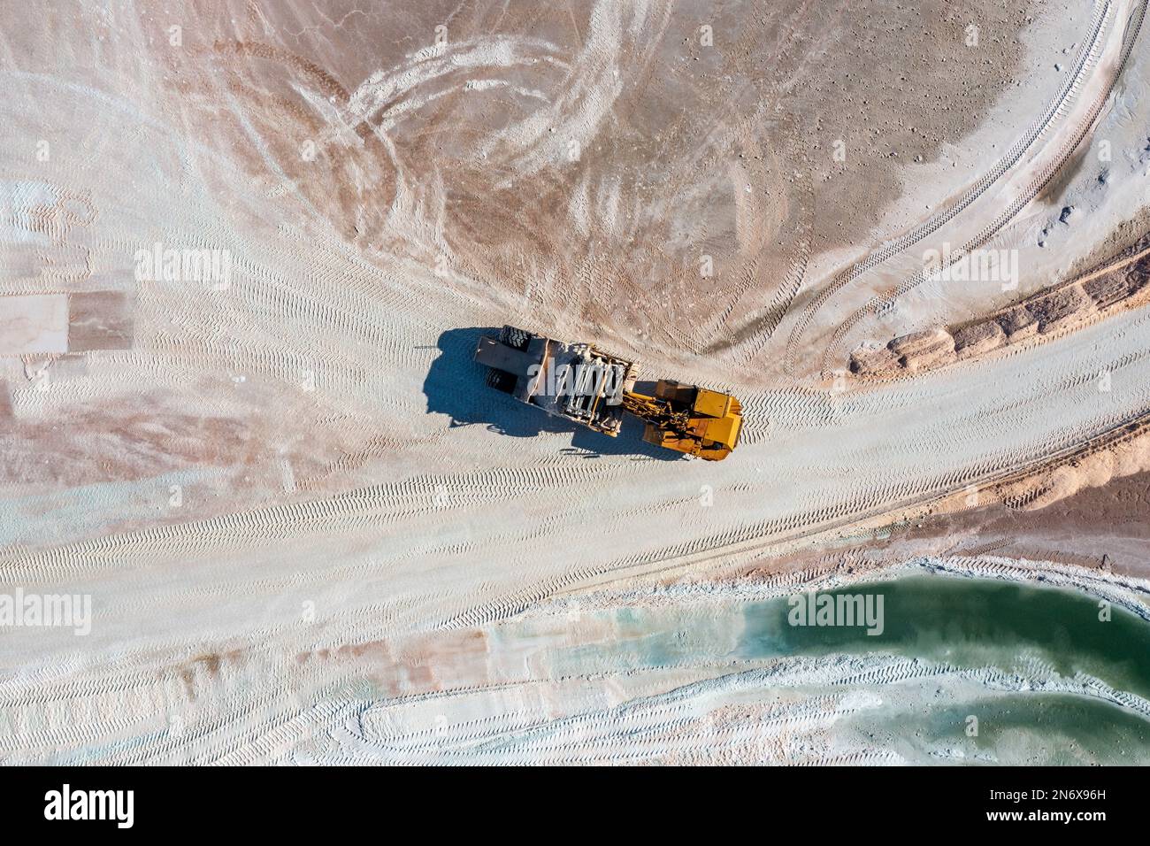 A heavy-duty scraper harvesting potash from an evaporation pond at a ...