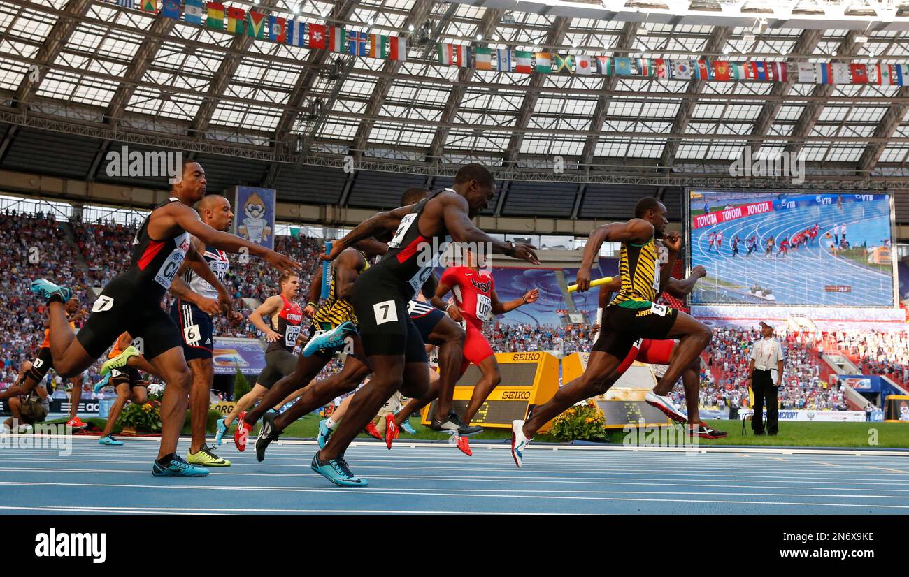 Jamaica's Usain Bolt, right, powers ahead after receiving the baton in ...
