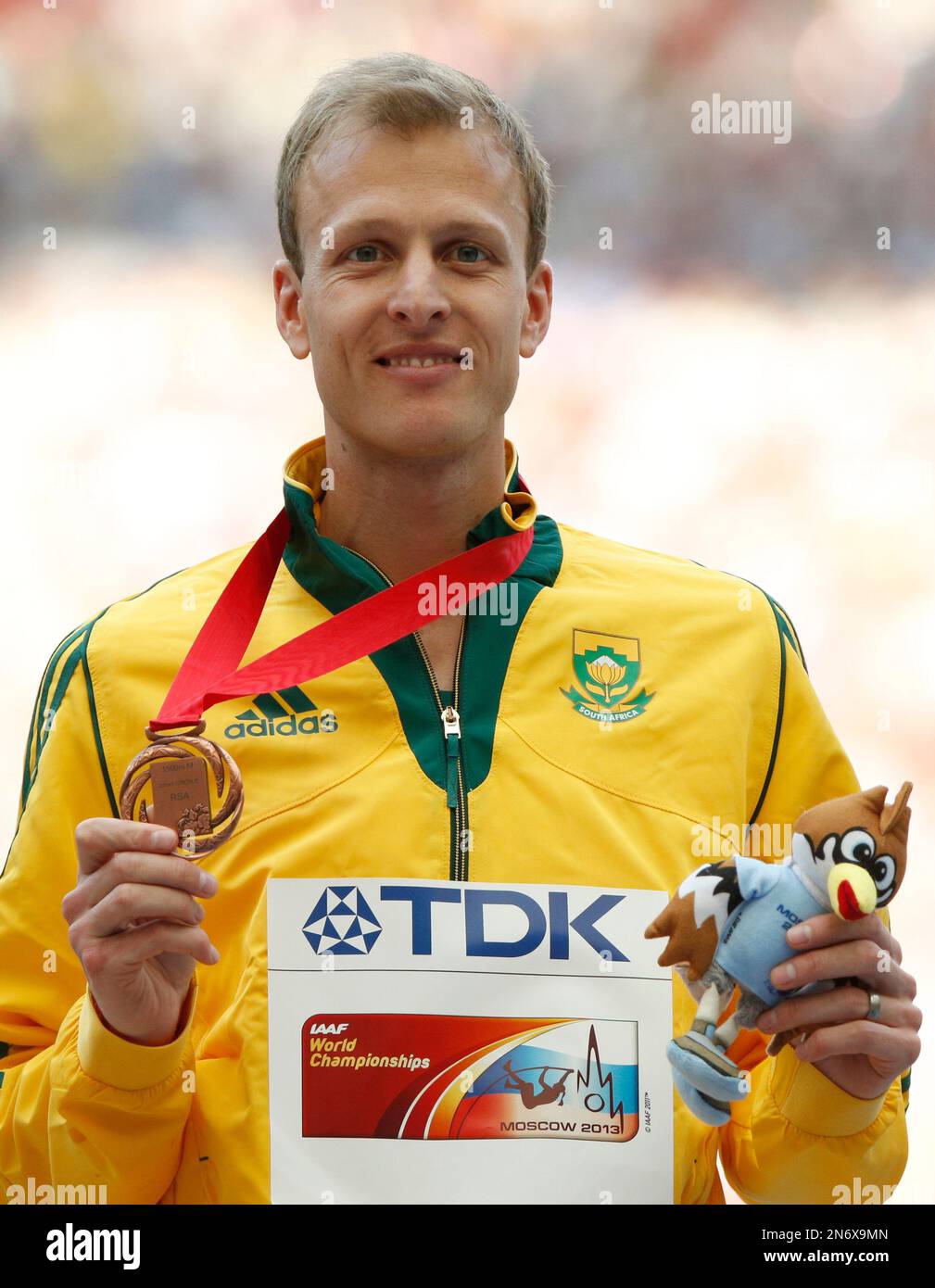 South Africa's Johan Cronje shows off his bronze medal for the men's 1500-meter final at the ...