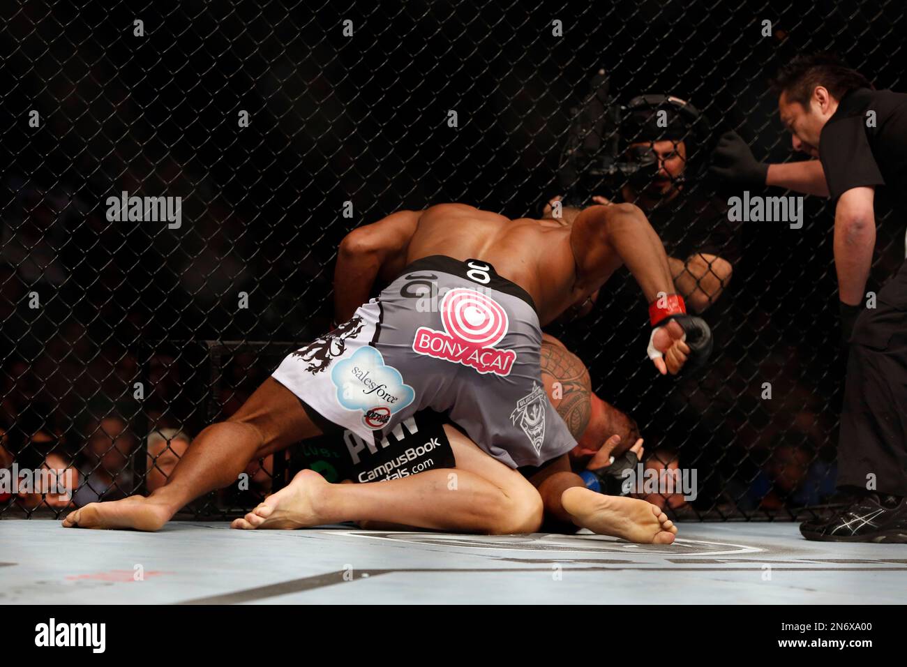Travis Brown receives punches from Alistair Overeem during their UFC on ...