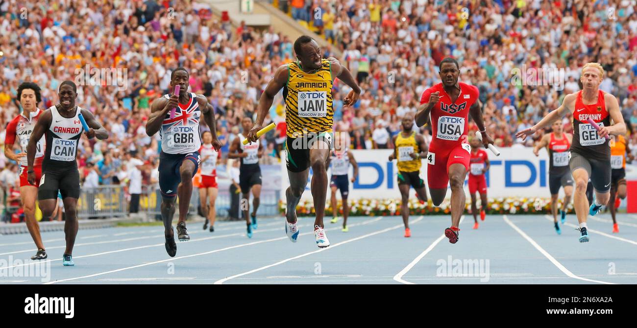 Jamaica's Usain Bolt, center, crosses the finish line ahead of United ...