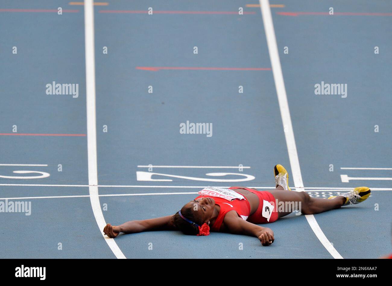 United States' Alysia Johnson Montano lies on the track after she fell ...