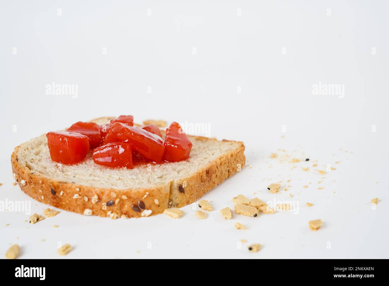 A slice of bread with quince jam isolated on white background Stock ...