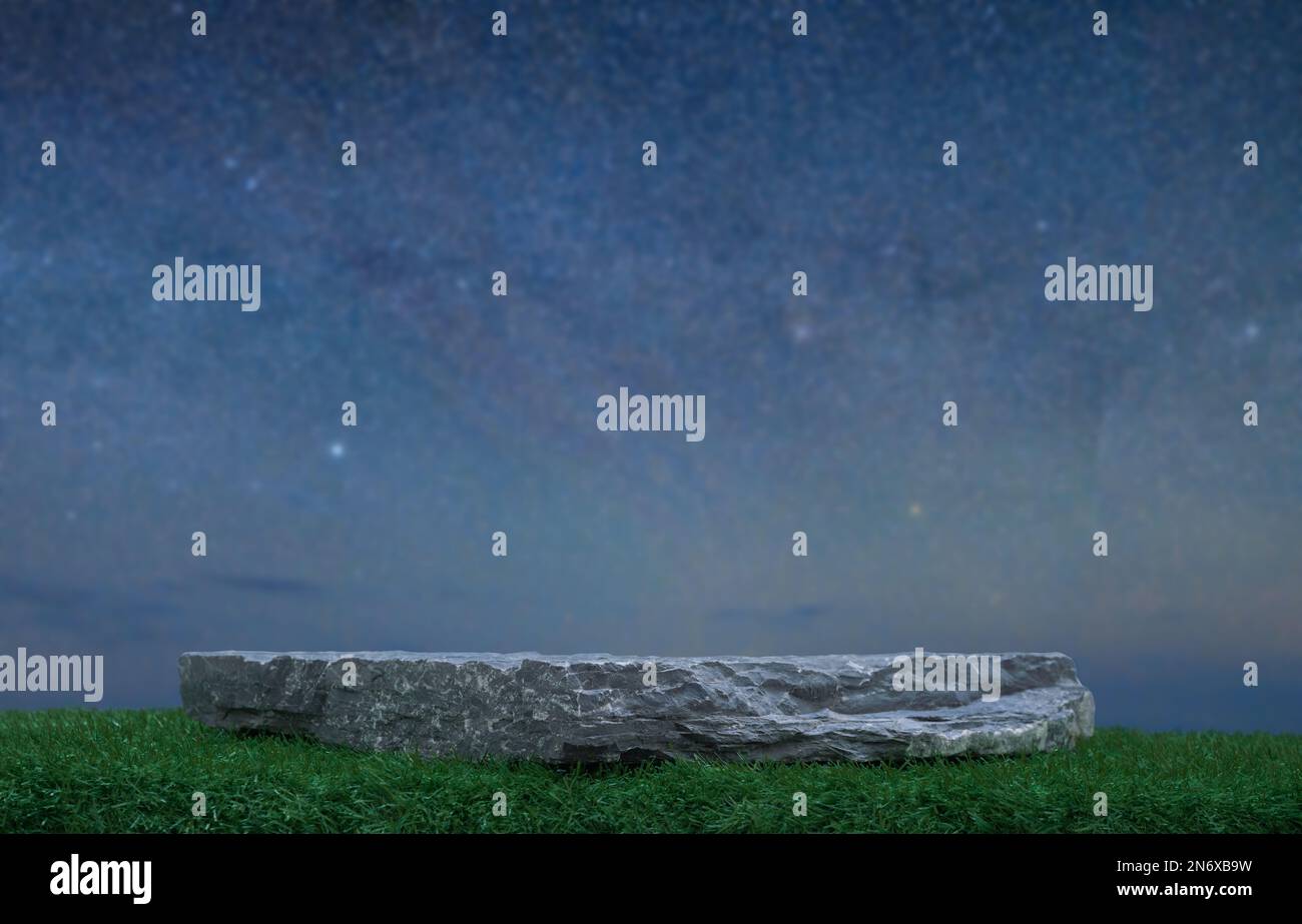 Stone granite podium rock table top on green grass in night sky star ...