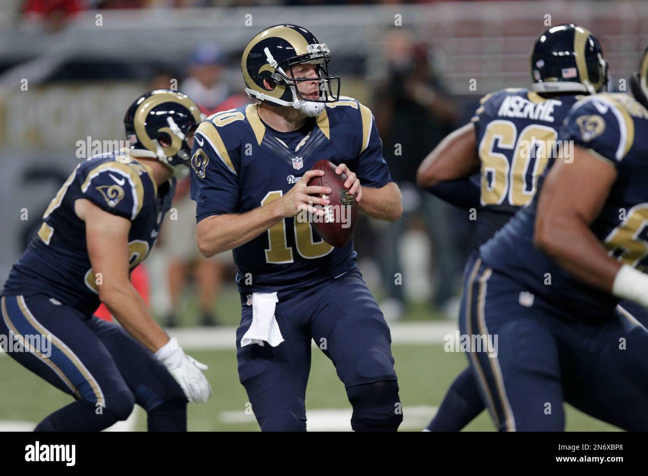 St. Louis Rams quarterback Kellen Clemens drops back to pass during the ...