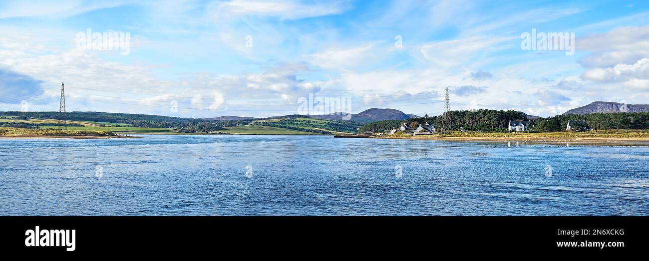 The mouth of Loch Fleet at Littleferry with electricity pylons reaching ...