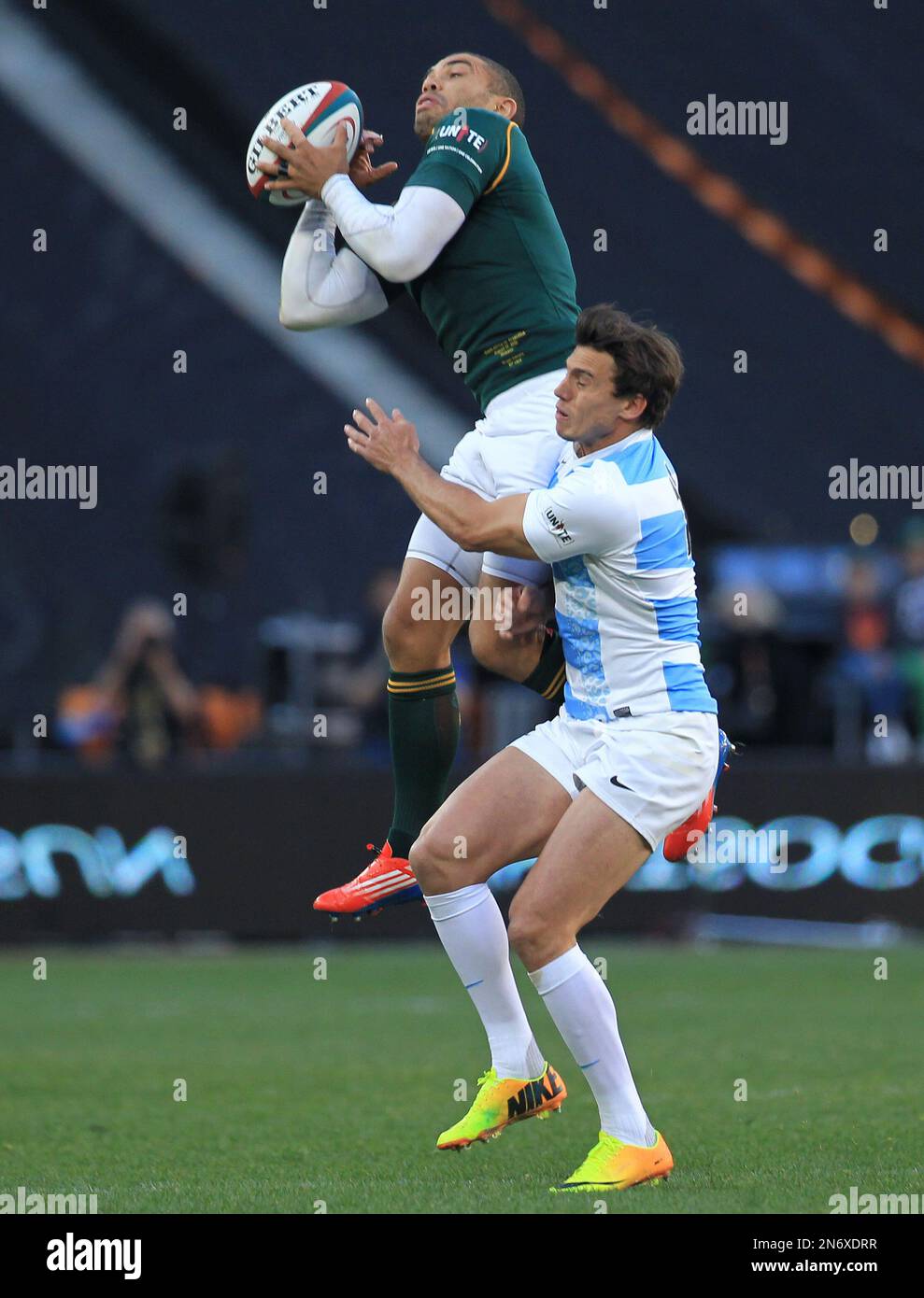South Africa's Bryan Habana, top, catches the ball as Argentina's Juan ...
