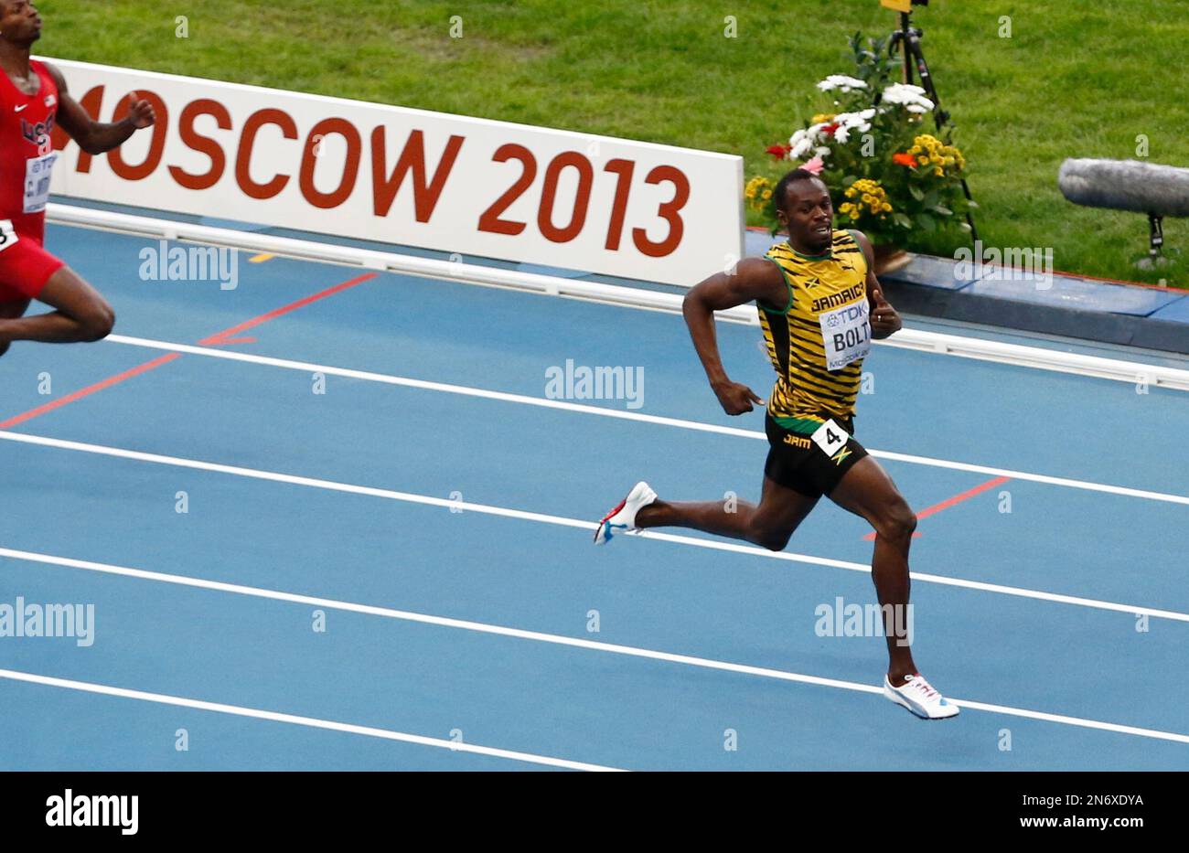 Jamaica's Usain Bolt approaches the finish line to win the gold medal ...