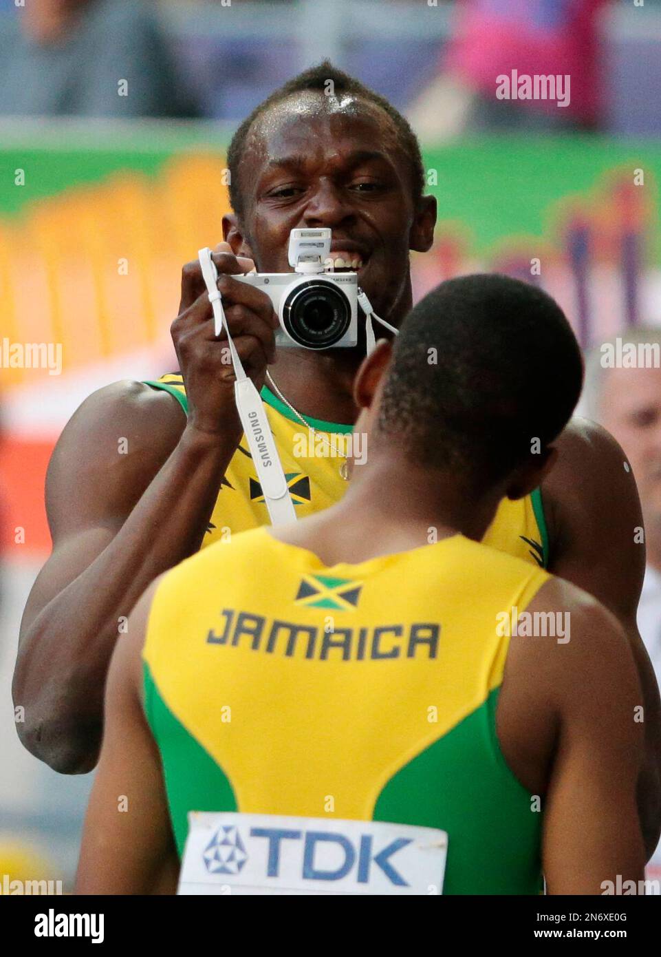 Jamaica's Usain Bolt, who won gold, takes a photograph of Jamaica's ...