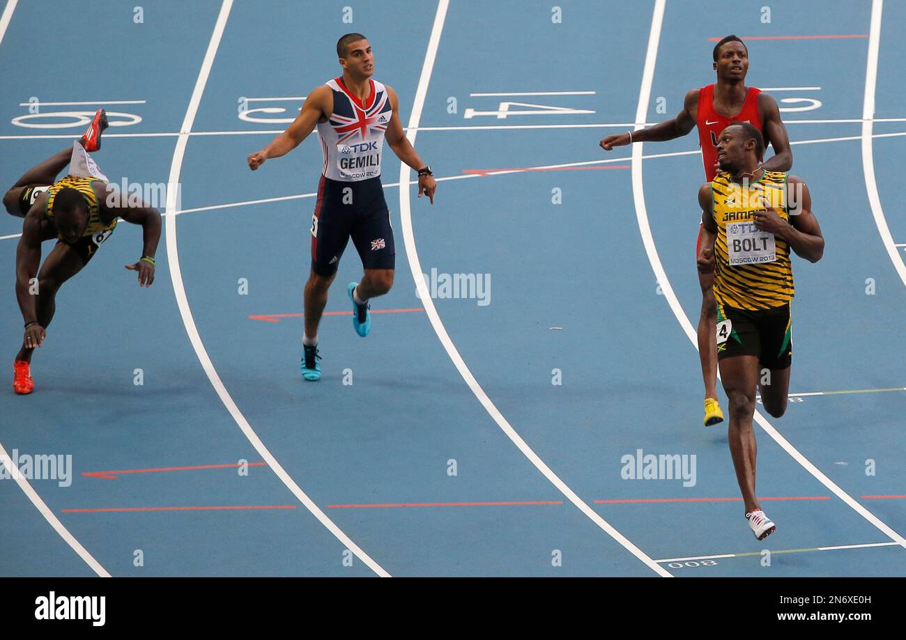 Jamaica's Usain Bolt looks over his shoulder after crossing the finish line to win the gold as ...