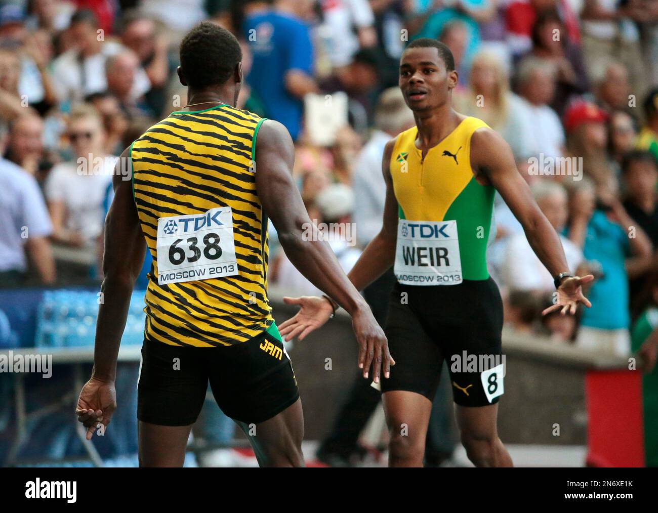 Jamaica's Usain Bolt, left, celebrates winning gold with Jamaica's ...