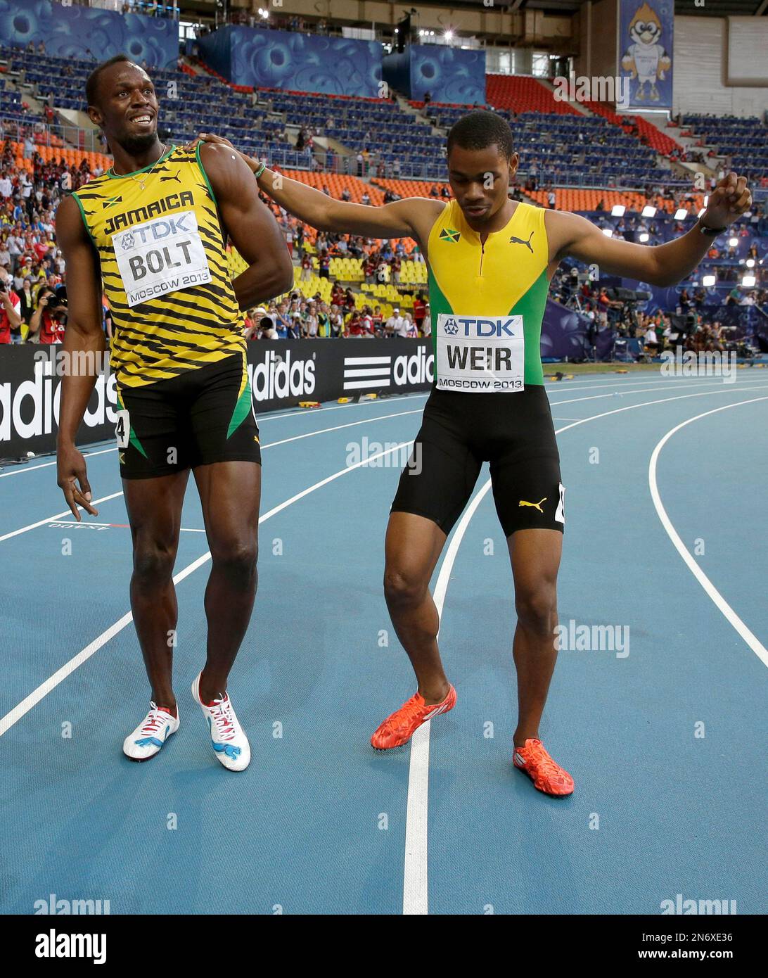 Jamaica's gold medalist Usain Bolt, left, celebrates wit his silver ...