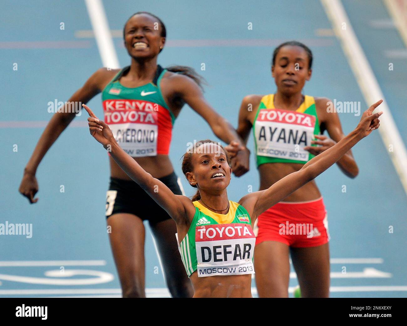 Ethiopia's Meseret Defar, center, reacts as she wins ahead of Kenya's ...
