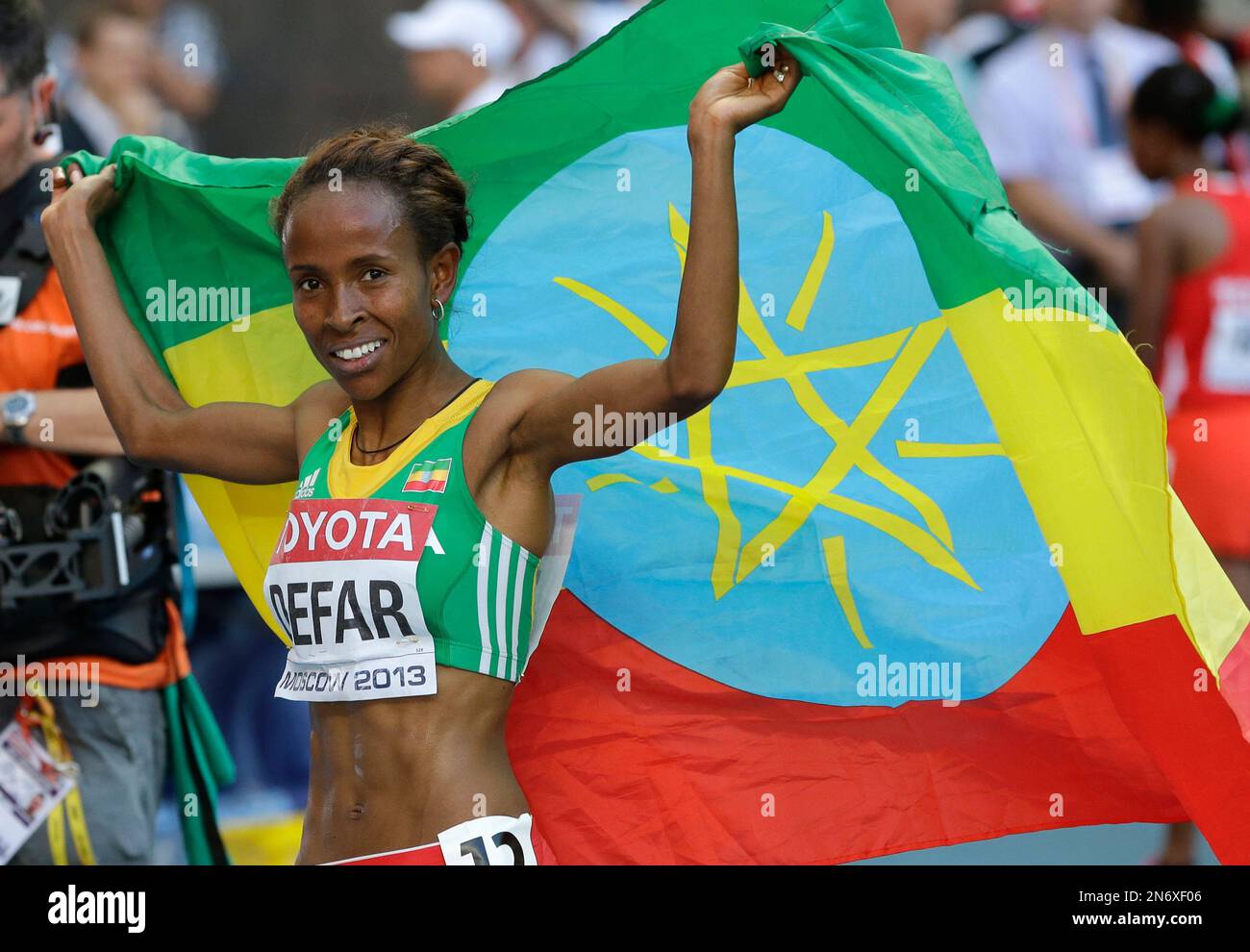 Ethiopia's Meseret Defar celebrates her gold medal finish in the women ...