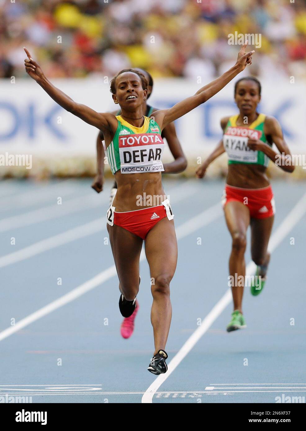 Ethiopia's Meseret Defar reacts as she crosses the finish line to win ...