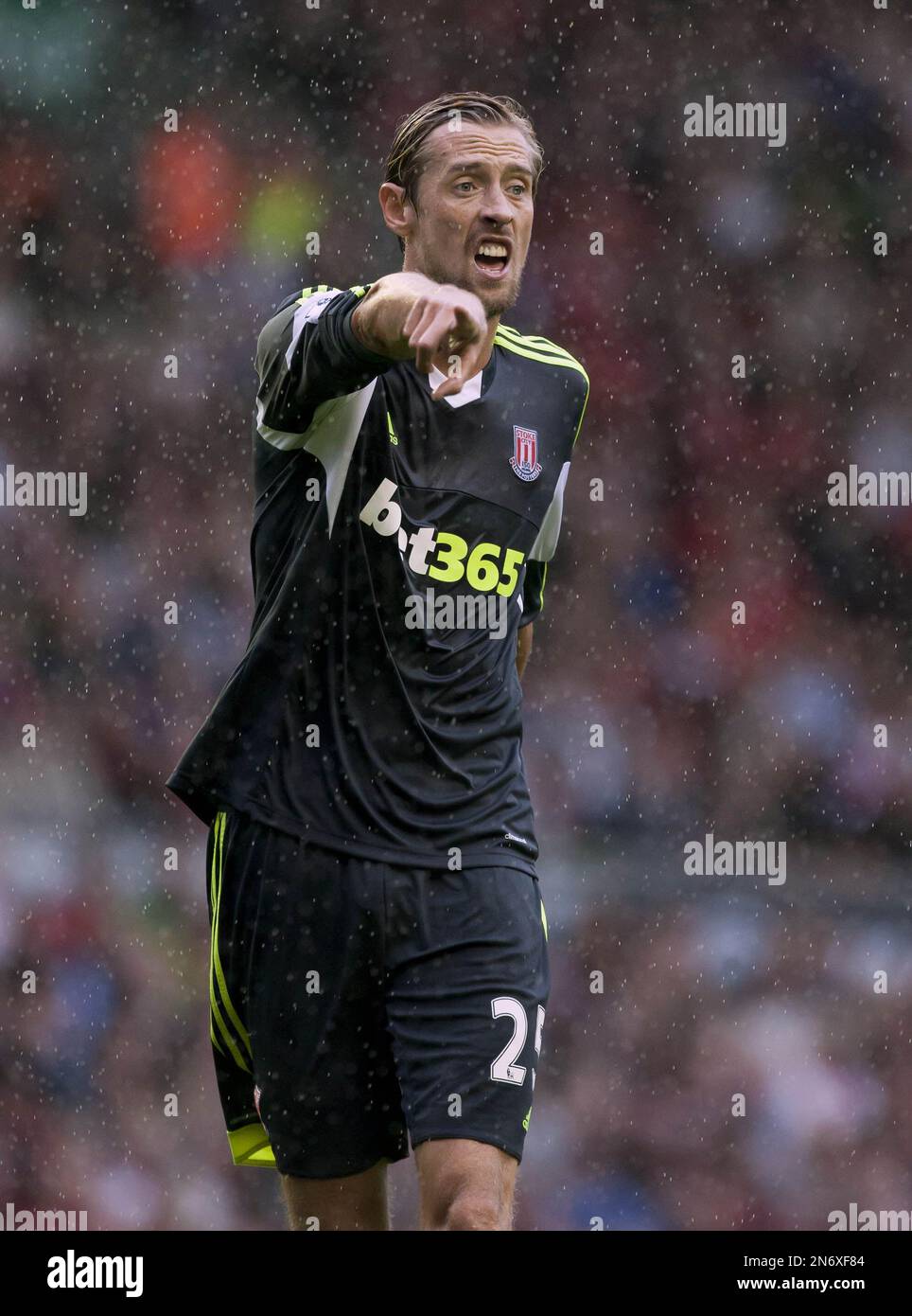 Stoke City's Peter Crouch gestures to teammates during his team's ...