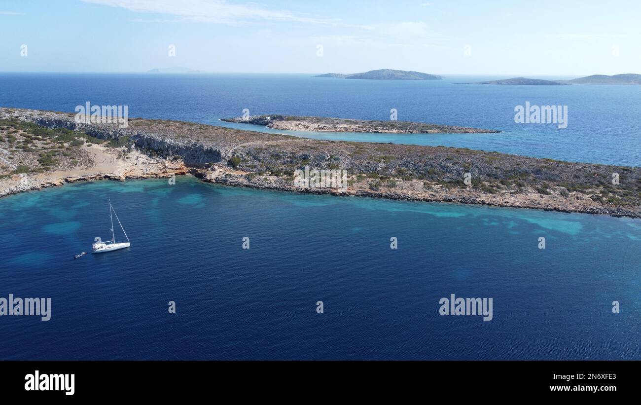 Aerial view of a sailng boat at anchor in Agios Fokas Bay, Astypalaia ...