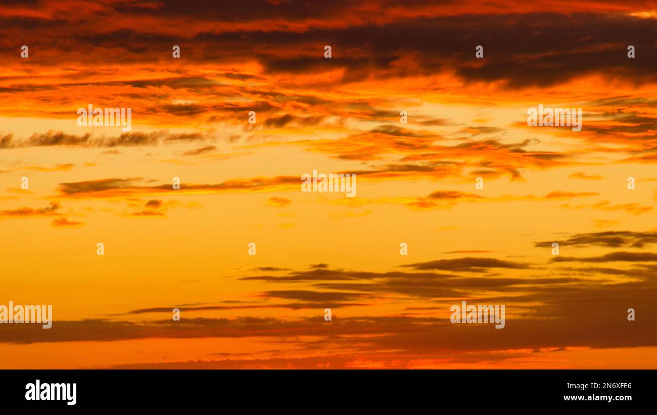 Background image with clouds in extreme colors of a sunset. The sky ...