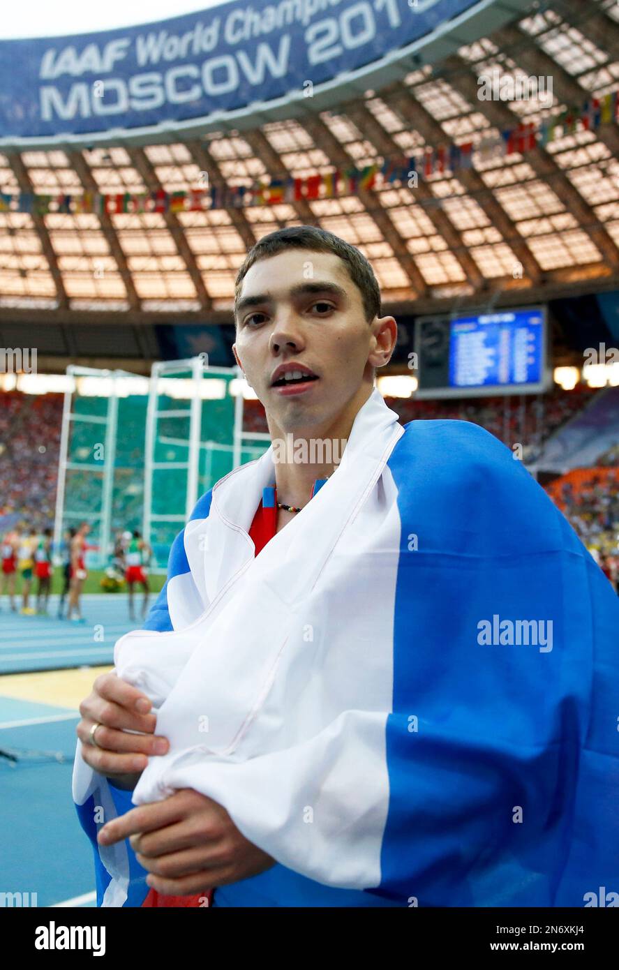 Russia's Aleksandr Menkov poses with the national flag after winning ...