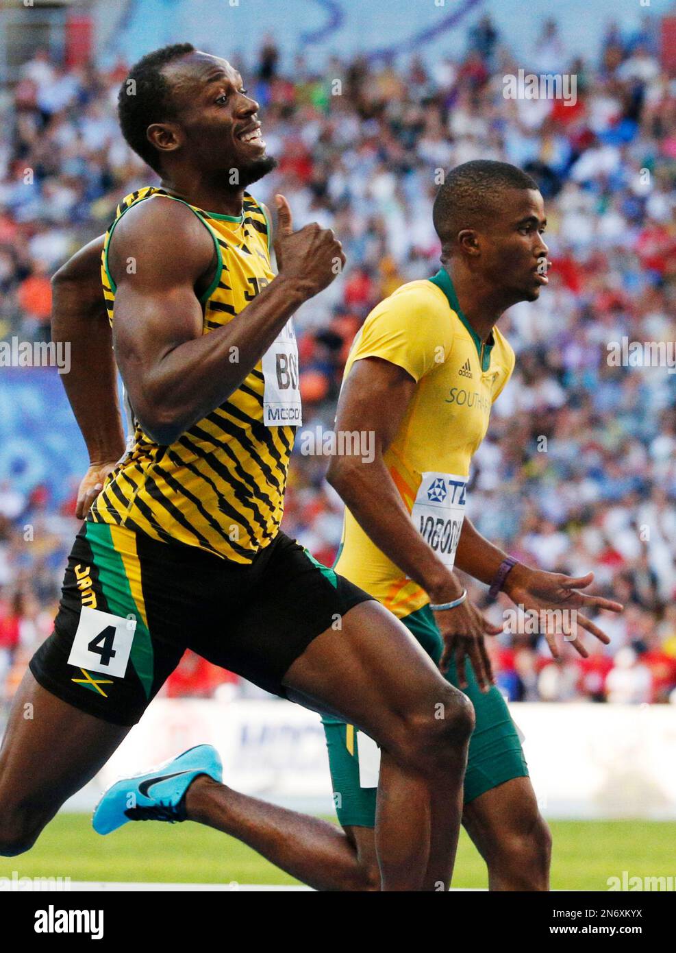 Jamaica's Usain Bolt, left, and South Africa's Anaso Jobodwana compete ...