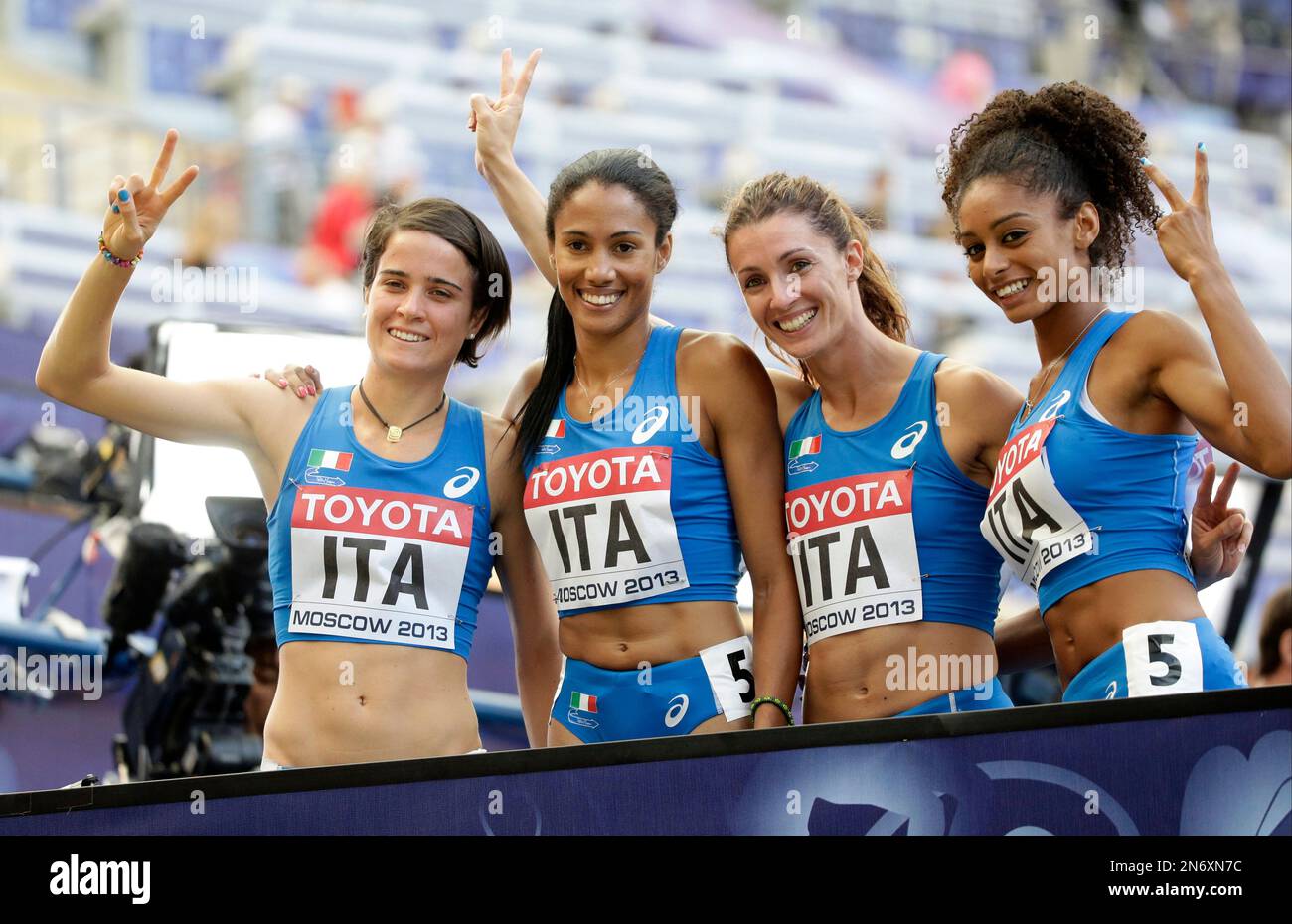 Members of the Italian women's 4x400-meter relay team pose for a ...
