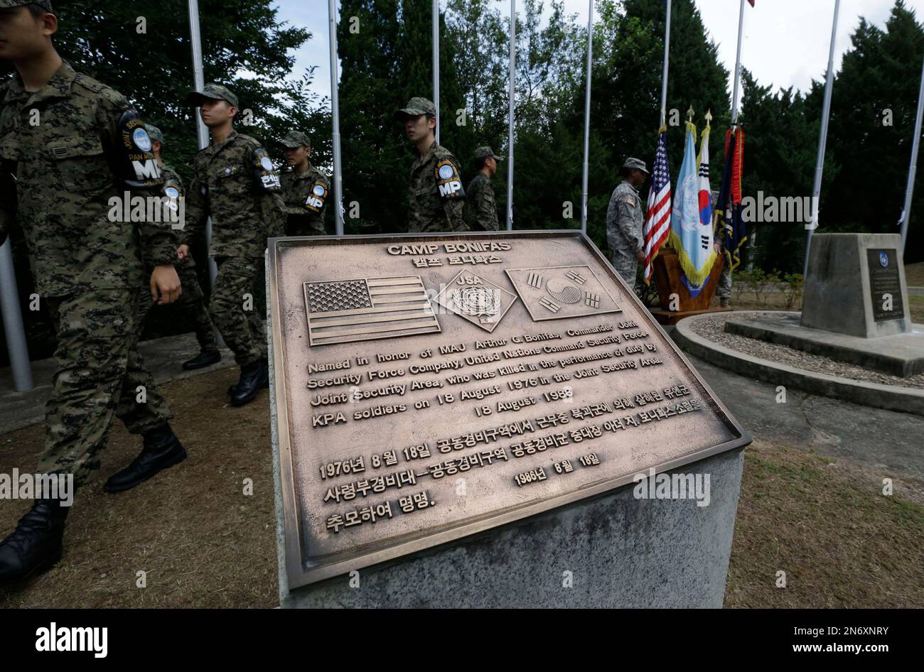 South Korean and U.S. soldiers walk by the Camp Bonifas naming ...