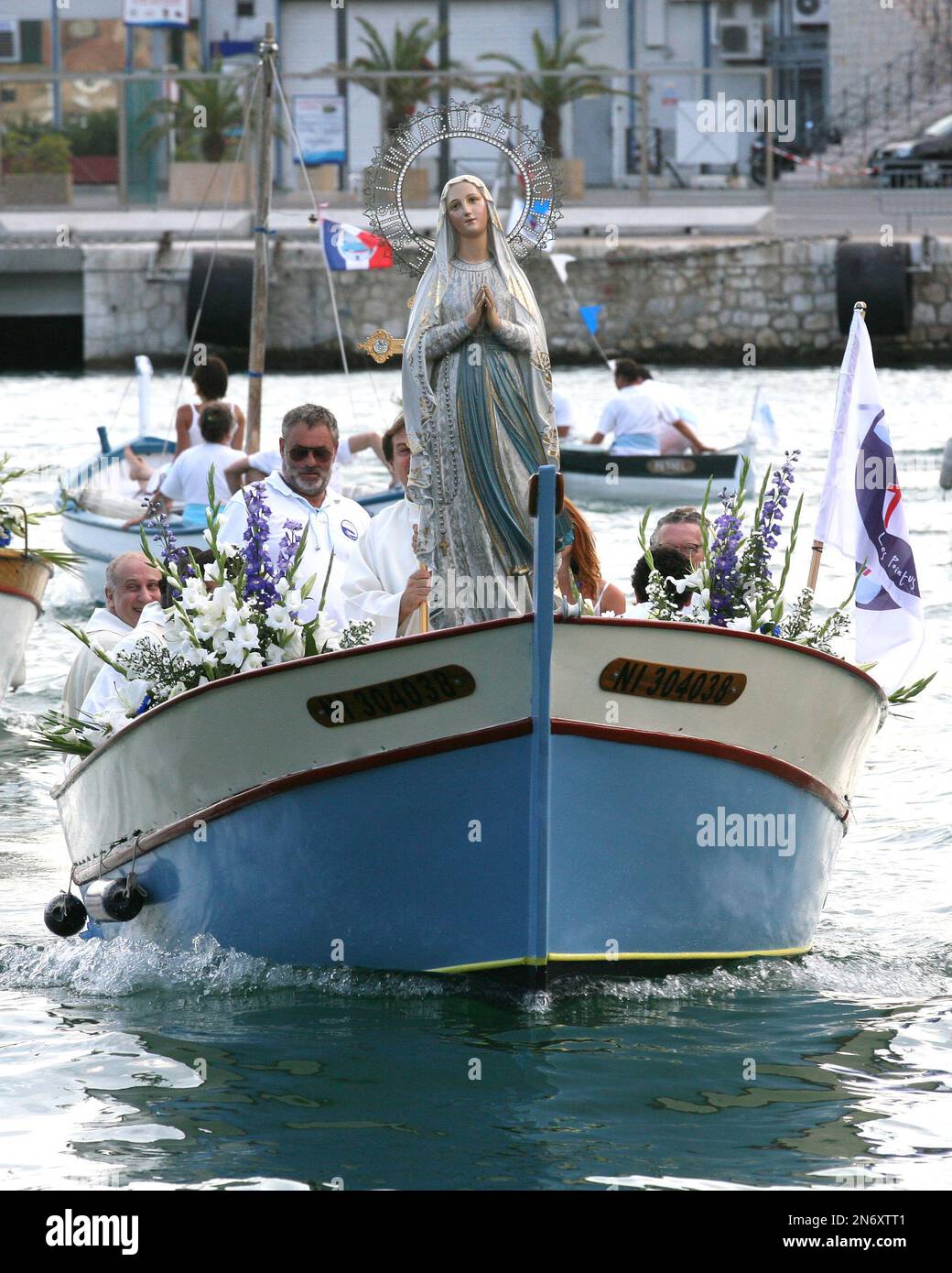 A procession with the statue of the Blessed Virgin Mary on a ...
