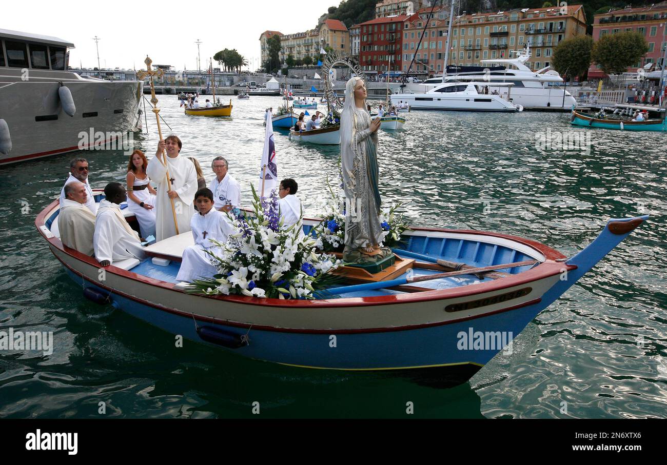 A procession with the statue of the Blessed Virgin Mary on a ...