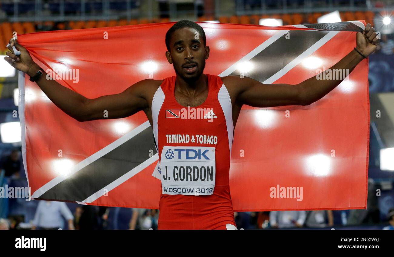 Trinidad and Tobago's Jehue Gordon poses with his national flag after ...