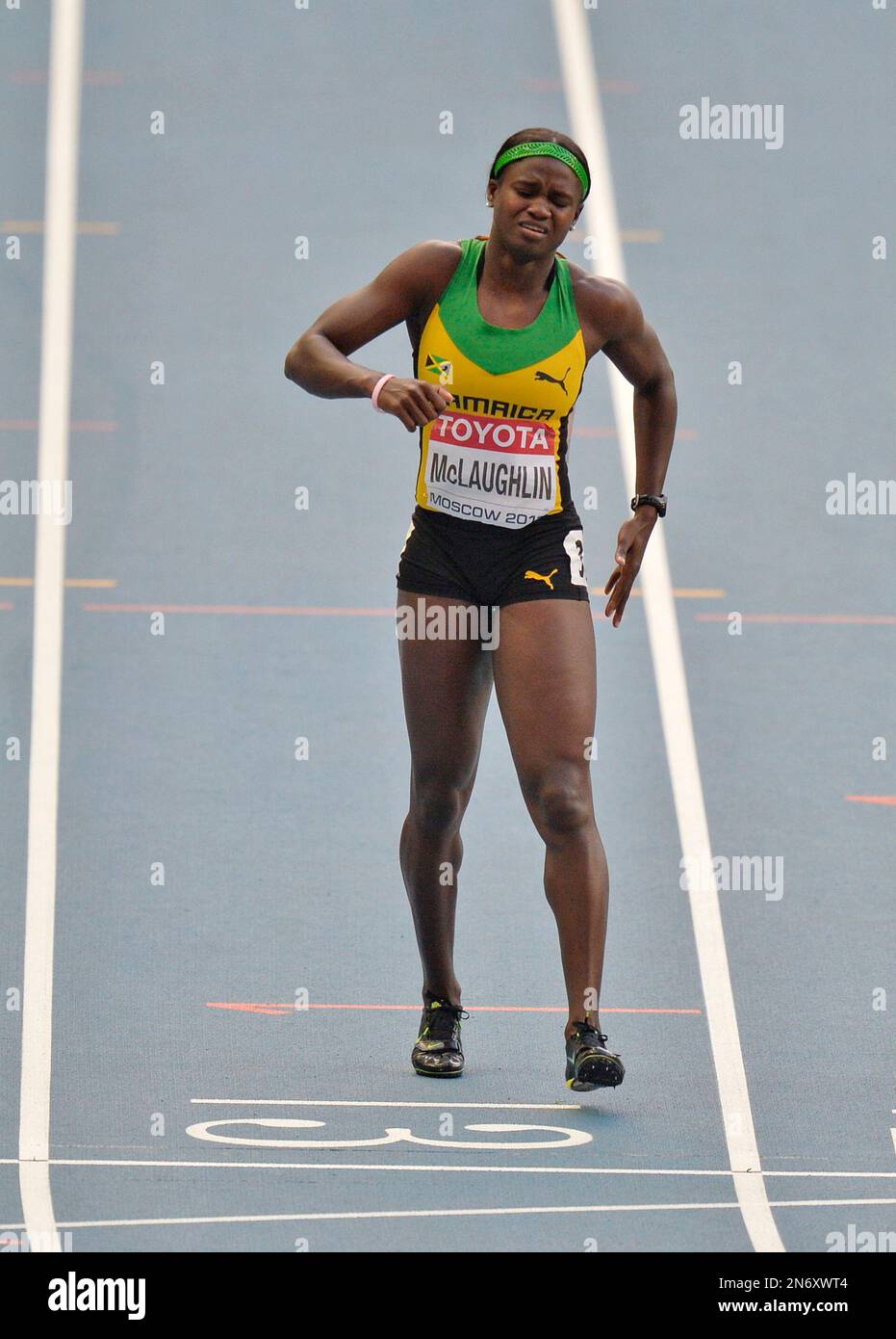 Jamaica's Anneisha McLaughlin limps to the finish line in a women's 200 ...