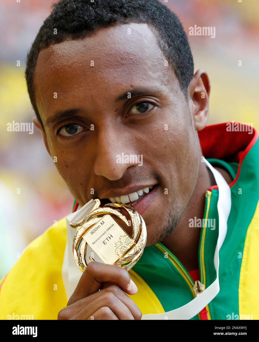 Ethiopia's Mohammed Aman poses with his gold medal for the men's 800 ...