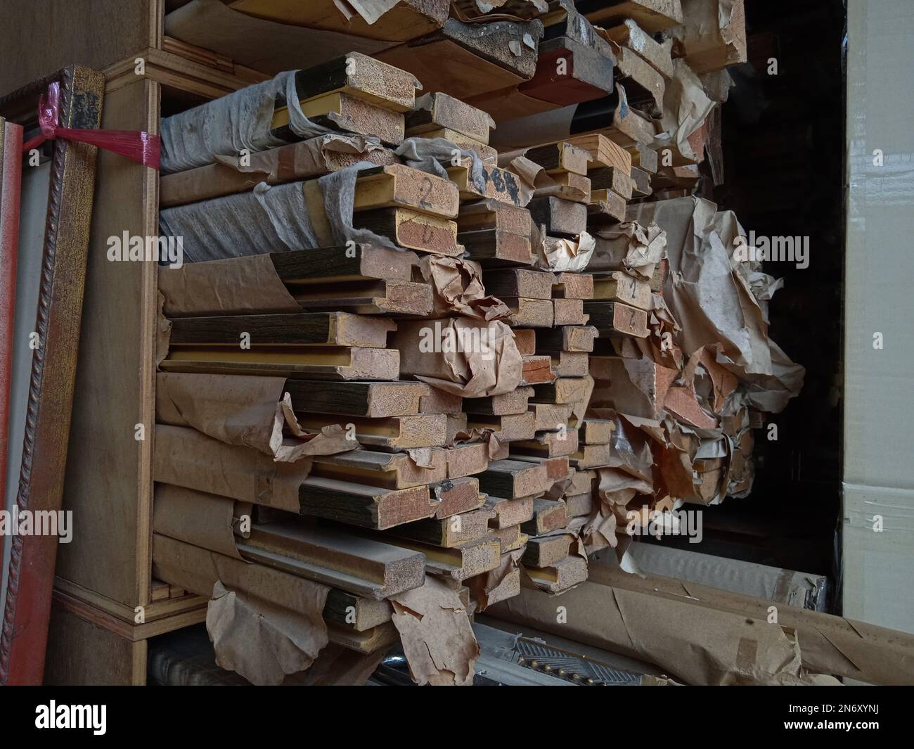 Lots of framing in a warehouse Stock Photo - Alamy