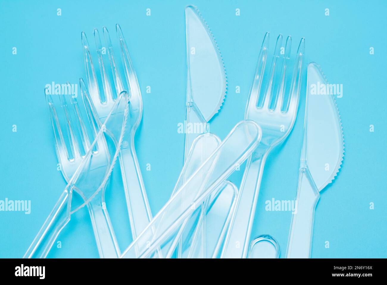 Plastic disposable tableware, cutlery. Fast food. Clean plastic forks ...