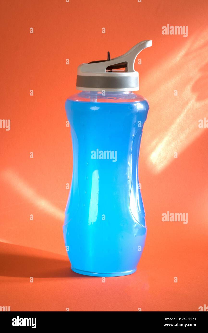 Isotonic drink. Cold blue detox cocktail in a sports bottle. Beverage ...