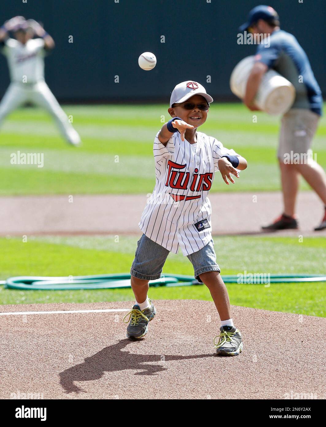 Six-year-old Minnesota Twins fan Andre Robinson throws out a ceremonial ...