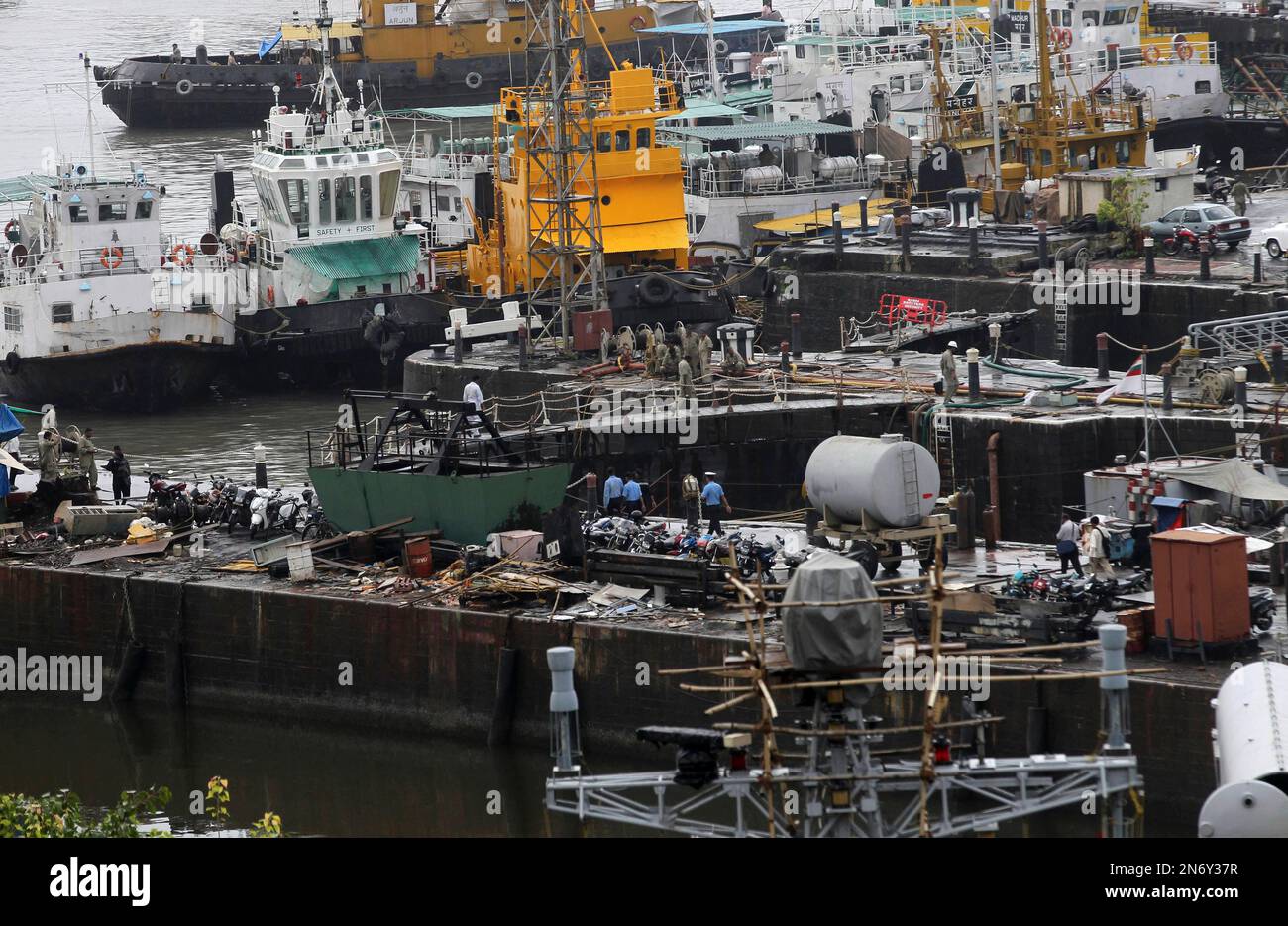 Ships are moored at a naval dockyard where a submarine caught fire and ...