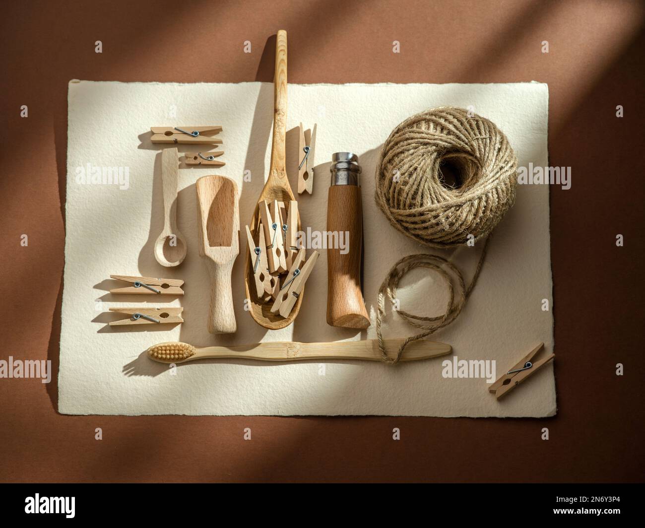 Flat lay with string ball, knife and wood clips Stock Photo - Alamy