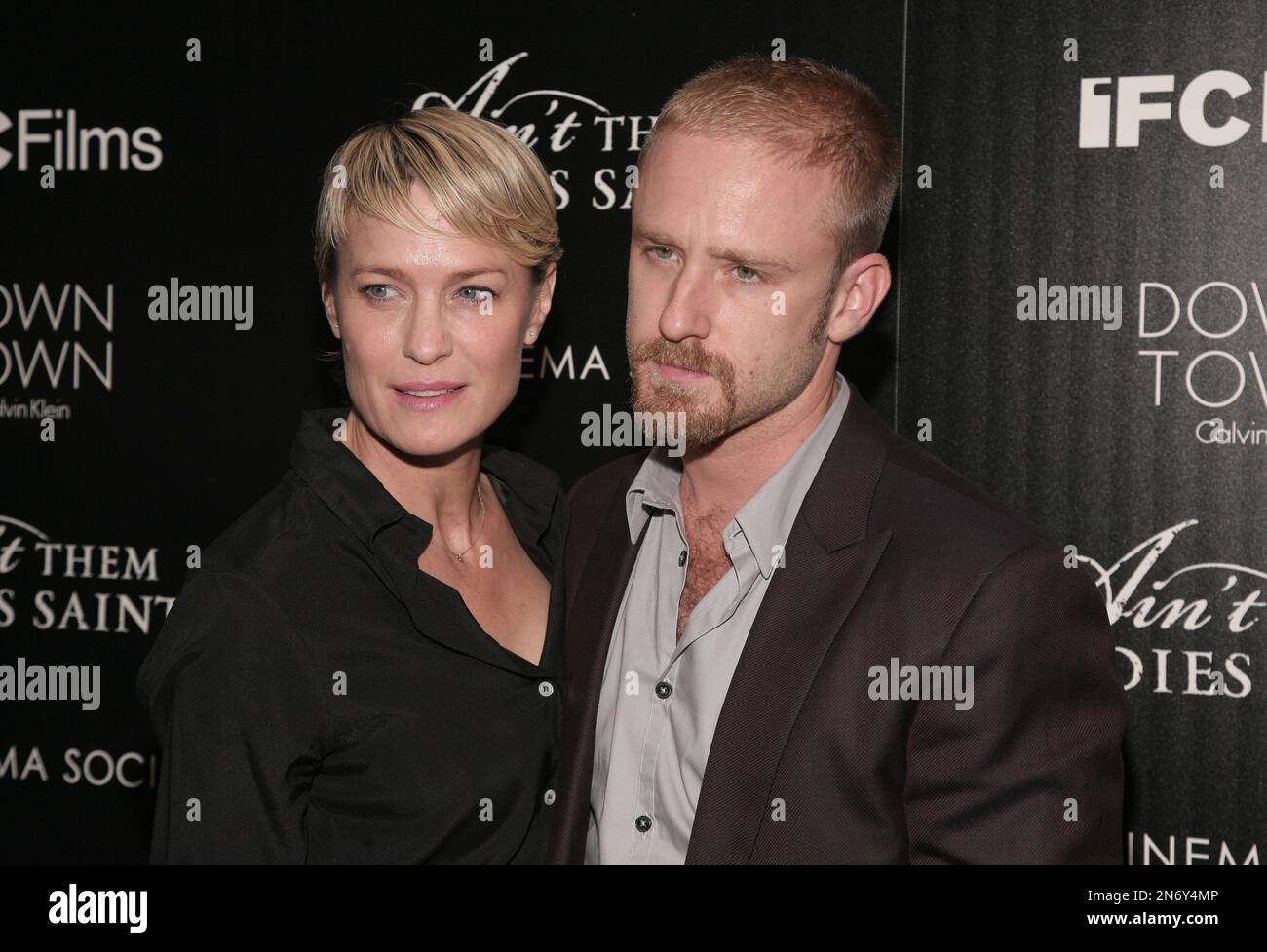 Actress Robin Wright, left, and actor Ben Foster, right, attend a ...