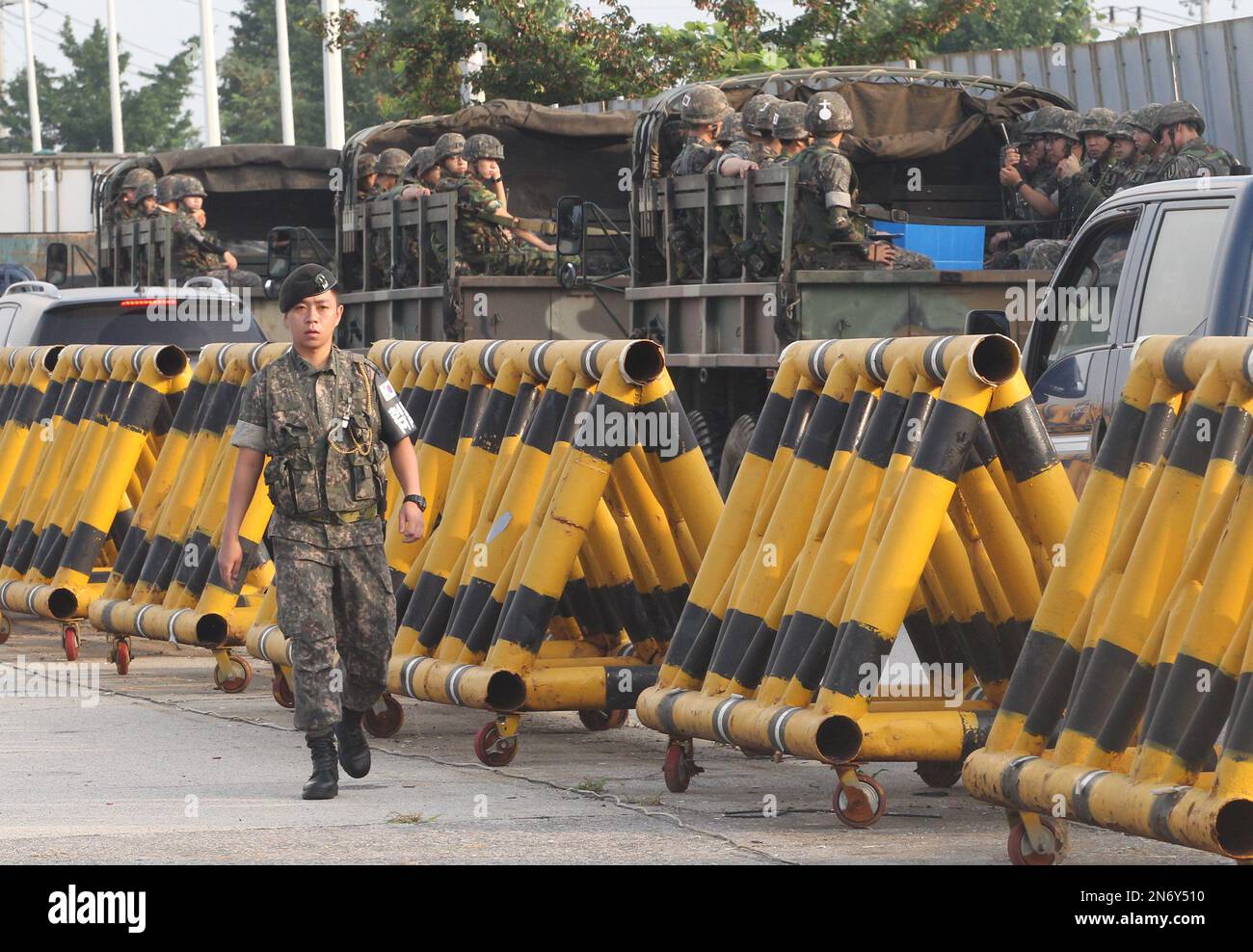 A South Korean army soldier patrols at the Unification bridge in Paju ...