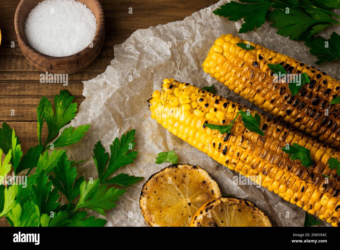 Delicious Grilled Mexican Corn with parsley, grilled lemon and salt ...