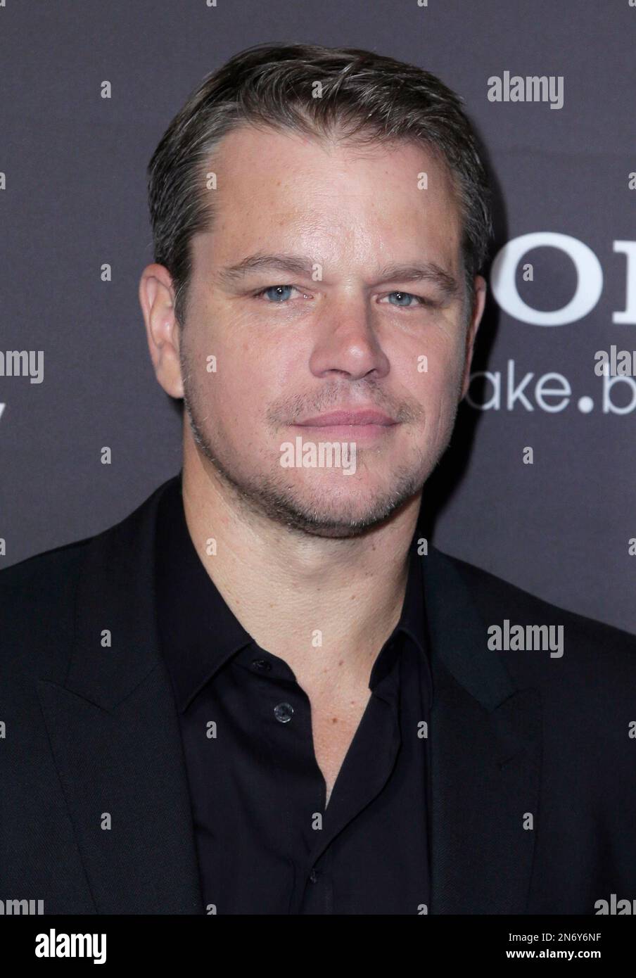 Actor Matt Damon poses for a photo as he walks the red carpet during ...